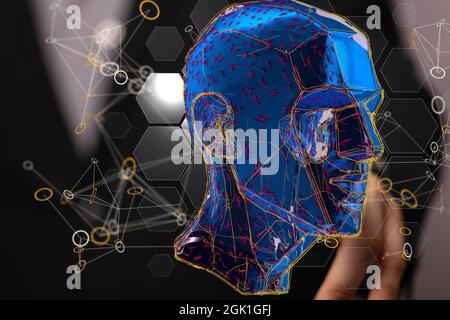A person presenting the virtual projection of the polygonal human face ...