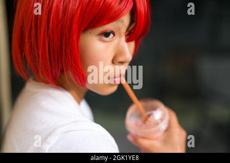 Closeup of Teenage Asian Cosplay Actress Drinking a Smoothie | Teenage ...