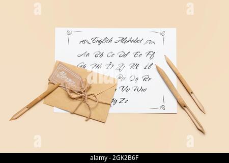 Envelope with name YEVA and dip pens on beige background Stock Photo ...