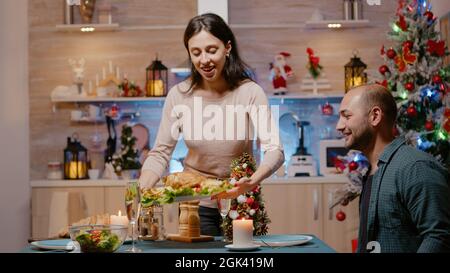 Young couple preparing for christmas meal Stock Photo - Alamy