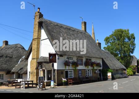 Traditional village pub Axe and Compass with thatched roof at ...