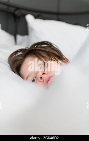 Sleepy teenager girl in bed Stock Photo - Alamy