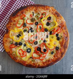 Delicious homemade cheesy pizza slice rustic round wooden board with ...