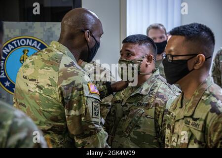 Maj. Gen. Xavier T. Brunson, the I Corps commanding general, presents a ...