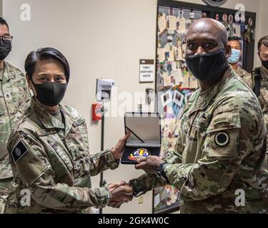 Maj. Gen. Xavier T. Brunson, the I Corps commanding general, presents a ...