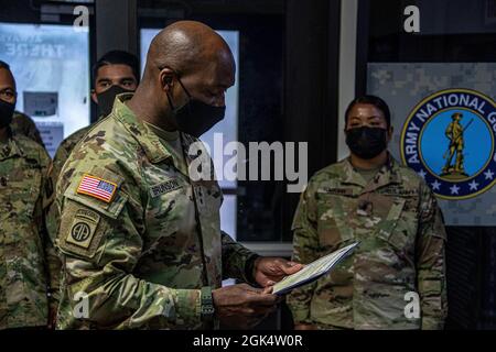 Maj. Gen. Xavier T. Brunson, the I Corps commanding general, presents a ...