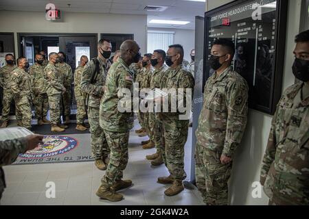 Maj. Gen. Xavier T. Brunson, the I Corps commanding general, presents a ...