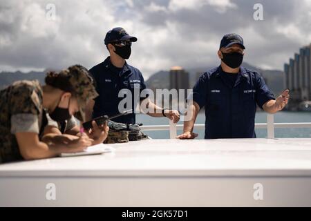 U.S. Marines and Coast Guardsmen establish communications with USCGC ...