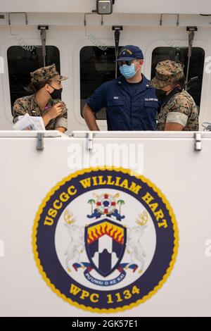 U.S. Marines and Coast Guardsmen establish communications with USCGC ...