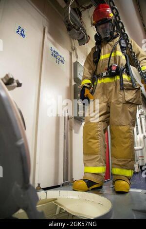 Damage Controlman Fireman in full uniform Stock Photo - Alamy
