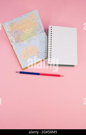 Top view of a two-sided pen and a notebook on a pink background Stock ...