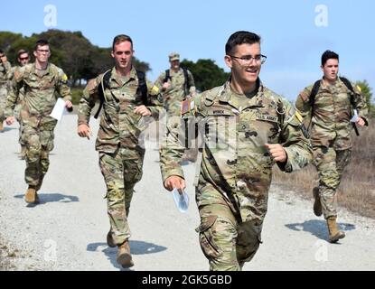 Members of Company C, 229th Military Intelligence Battalion, run to a ...