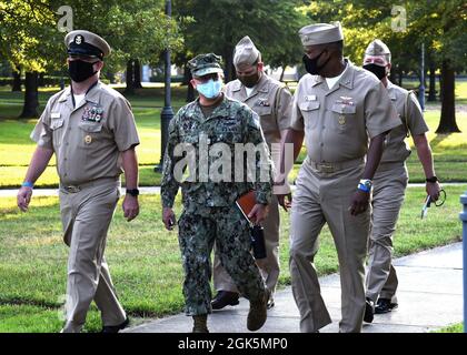 Navy Adm. Alvin Holsey, right, applauds as his wife Stephanie Holsey is ...