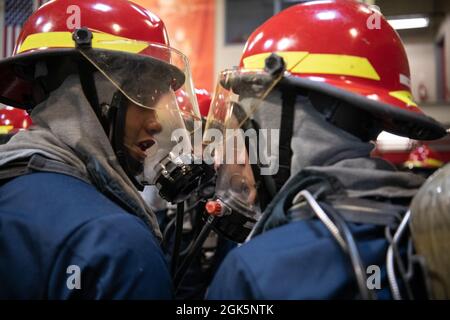 Recruits communicate during a firefighting training exercise inside the ...