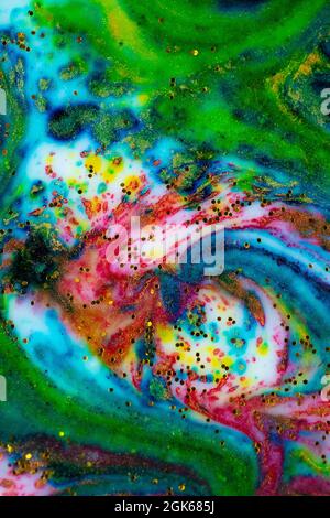 Colorful multicolored paints are covered with water drops. Multicolor ...