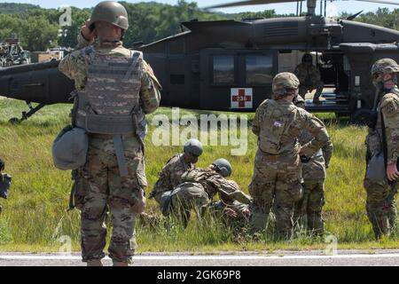 U.S. Army Soldiers of the 78th Training Division observe the offloading ...