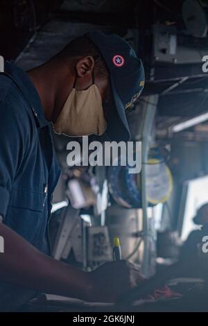 US Navy Quartermaster of the Watch, Quartermaster 1st Class prepares to ...
