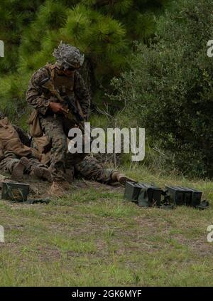 A U.S. Marine with the Infantry Unit Leaders Course drops into the ...