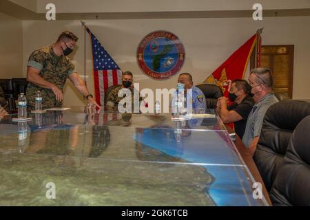 Lt. Col. Tate Buntz, the Marine Corps Base (MCB) Camp Blaz Operations Officer, briefs personnel ...