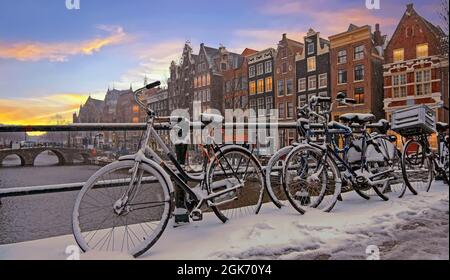 City scenic from a snowy Amsterdm in winter in the Netherlands at ...