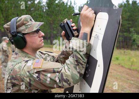 Army Reserve Spc. Scott R. Milne, assigned to the 447th Military Police ...