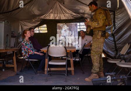 Northern Territory Government officials James Bear, Luke Bowen, and ...