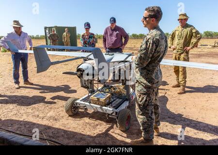 Northern Territory Government officials James Bear, Luke Bowen, and ...