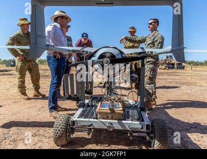 Northern Territory Government officials James Bear, Luke Bowen, and ...