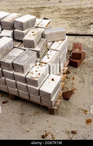 Shot of building blocks on pallets outdoors Stock Photo - Alamy