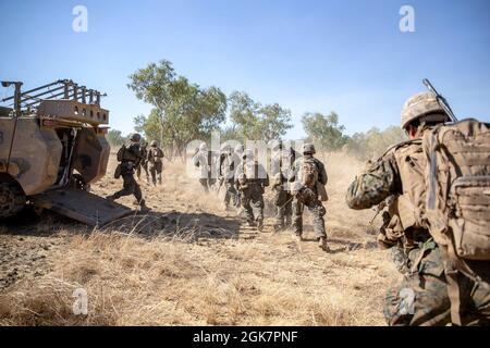 Armored Personnel Carriers (APCs) and tanks from the 3rd Tank Battalion ...