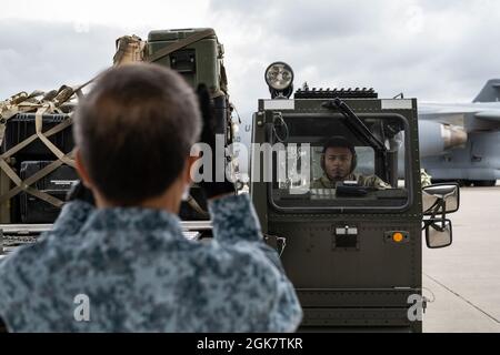A Tunner 60K aircraft cargo loader delivers cargo to a U.S. Air Force C ...