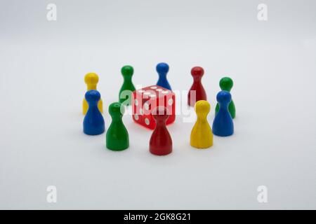 Different colours and shapes of pawn pieces and dices from board games ...