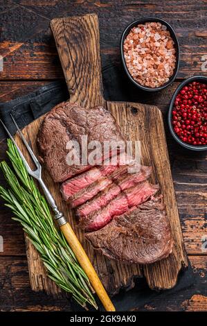 Fried Top Blade or flat iron roast beef meat steaks on wooden board ...