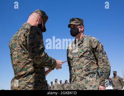 Hospital Corpsman Third Class (HM3) K. Bonitch, left, places a specimen ...