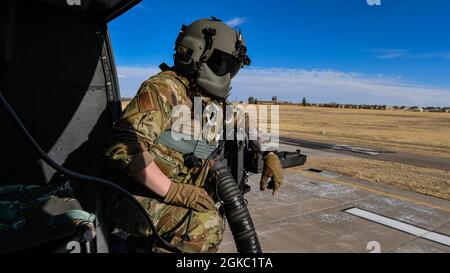 Senior Airman Kayli Conrad, flight engineer and gunner, sits on an all ...