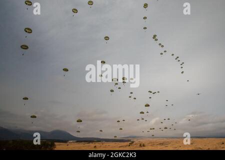 Bundles descend from a Japan Air Self-Defense Force C-130H Hercules ...
