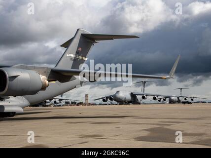 Heavy lift aircraft sit on the flight line at Travis Air Force Base ...