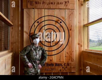 Chief Master Sgt. Tori Jones, wing command chief, signs an axe during ...