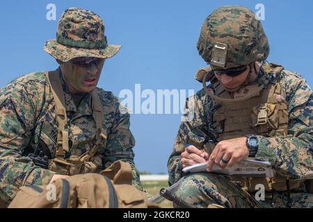 U.S. Marine Corps Maj. Jacob Fernandez (right), the outgoing assistant ...
