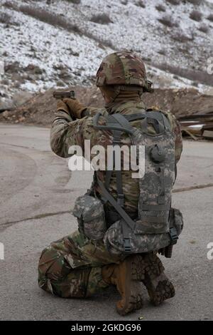 Soldiers participating in the Best Warrior Competition perform a ruck ...