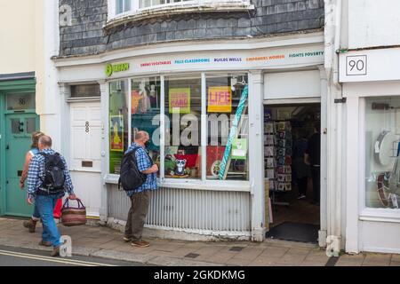 Independent shops and shoppers in Totnes High Street, South Hams, Devon ...