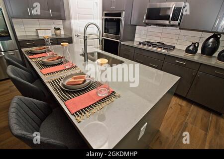 Counter tops and sink in kitchen Stock Photo - Alamy