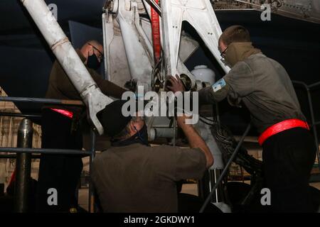 Airmen with the 7th Equipment Maintenance Squadron align the B-1B ...