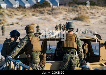 Sailors assigned to Beachmaster Unit (BMU) TWO observe an approaching ...