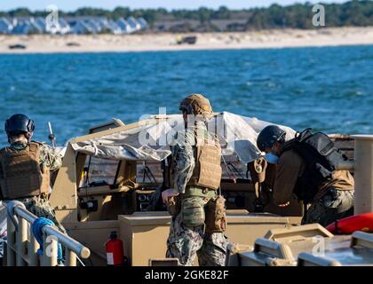Sailors assigned to Beachmaster Unit (BMU) TWO observe an approaching ...