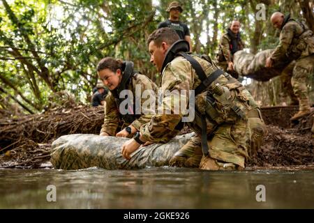 U.S. Army Jungle School Students carry their squad zodiac in ...