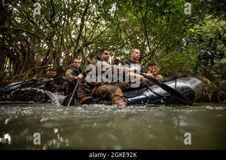 U.S. Army Jungle School Students prepared a ruck raft in order to ...