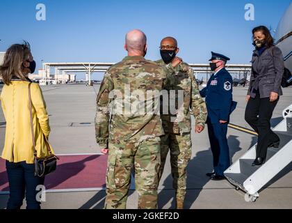Air Force Test Center Commander Maj. Gen. Evan Dertien, left, hands the ...
