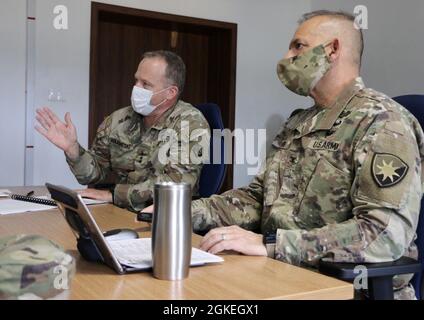 Army Lt. Gen. John Kolasheski (left), V Corps commanding general, presents Lt. Gen. Flem B ...