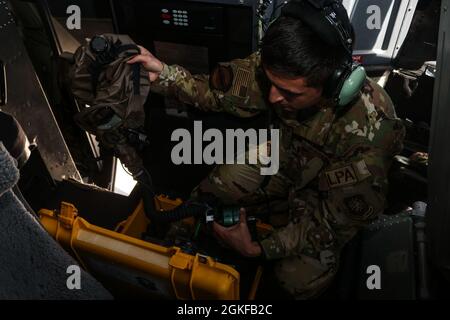 1st Lt. James Wishart, 40th Airlift Squadron co-pilot, dawns an aircrew ...
